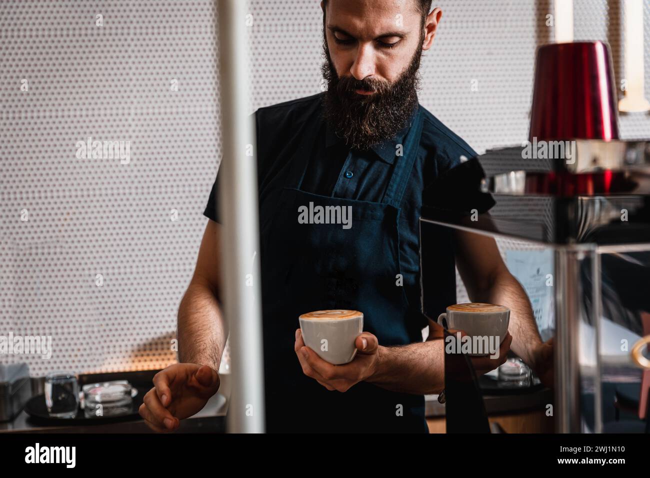 Barista preparing cappuccino on espresso machine for customer in coffee ...