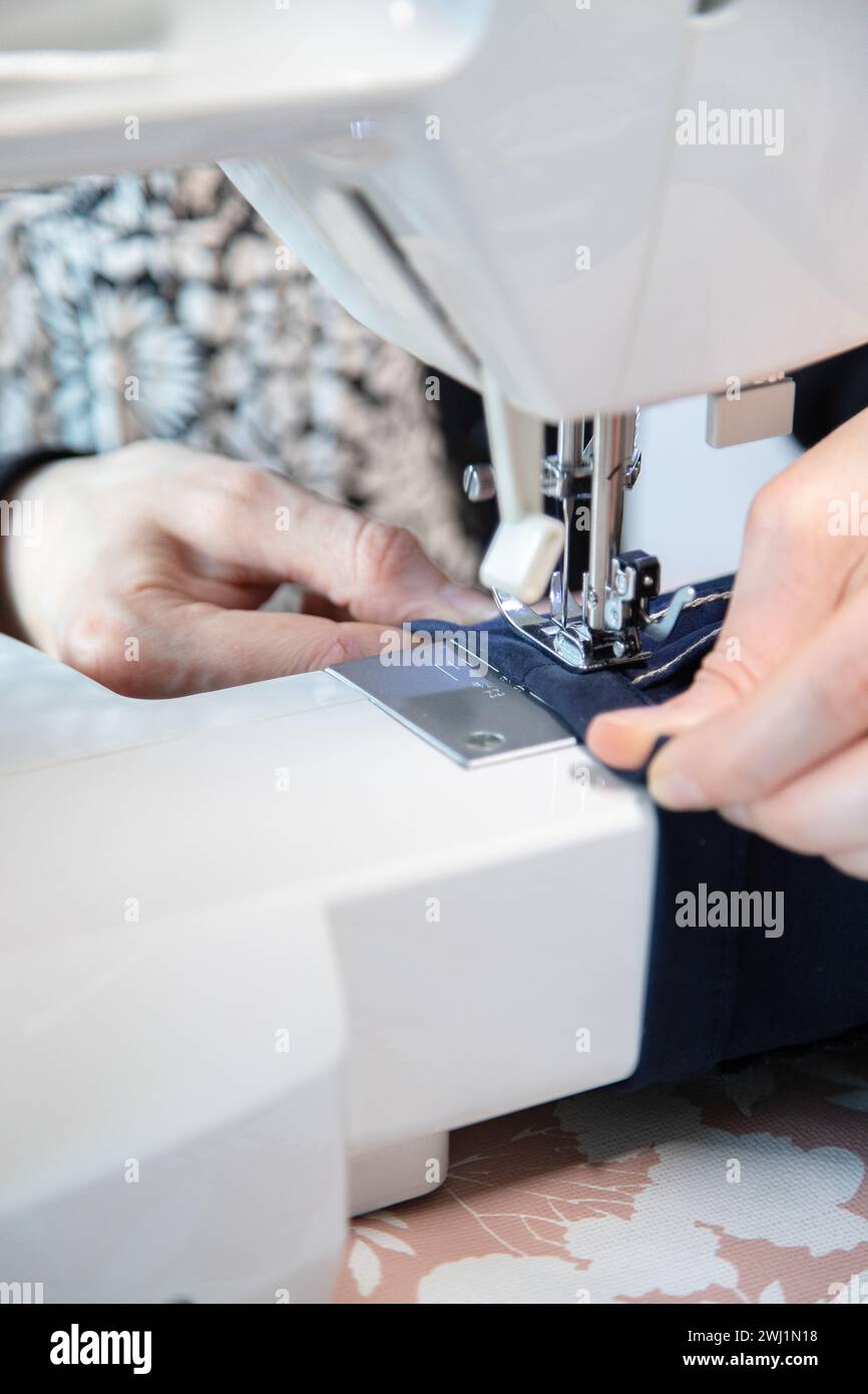 Detail of sewing work execution. Recycling clothes at home to reduce ...