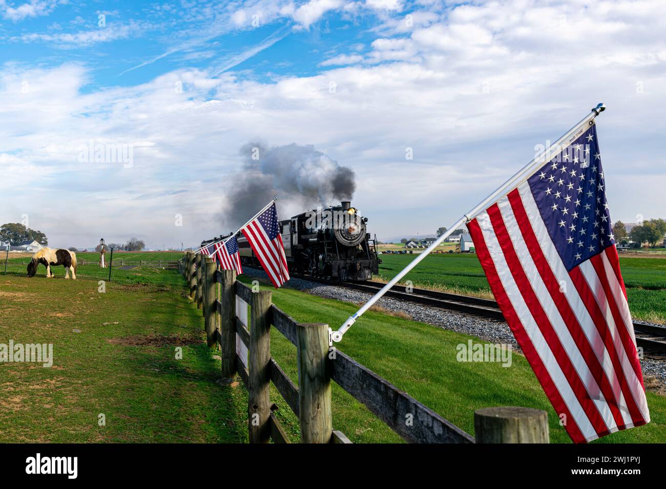 View of an Antique Steam Passenger Train Approaching With a Line of ...