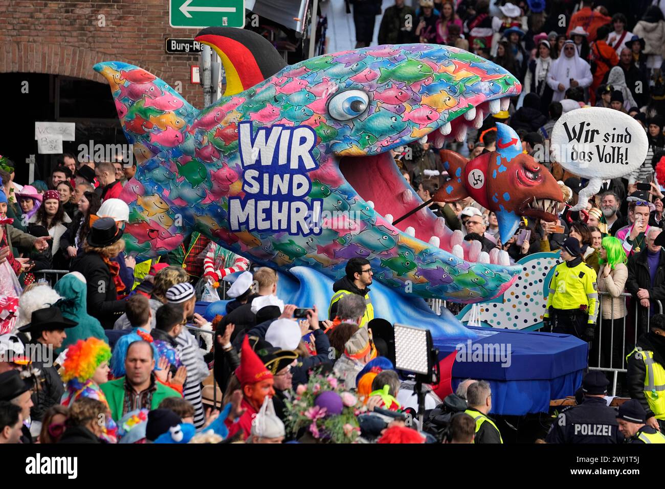 A carnival float depicts the massive demonstrations against far-right ...
