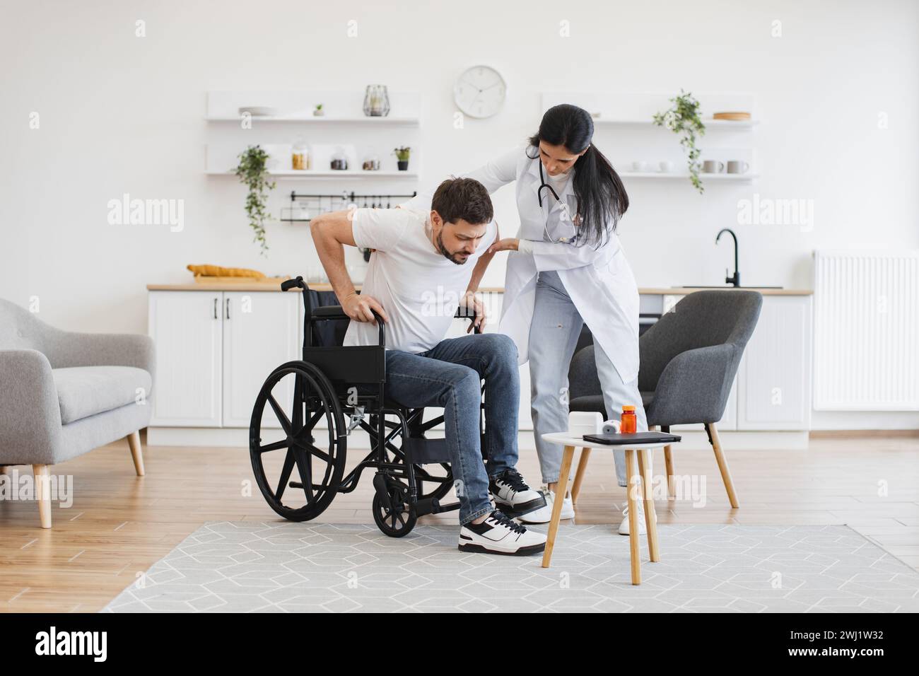 Health professional consulting man after back injury about physio ...