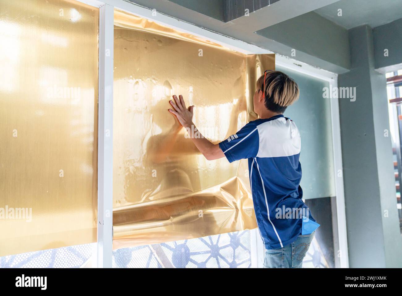 Tinted glass in the building. window dimming by golden dimness film ... Tinted glass in the building. window dimming by golden dimness film ...