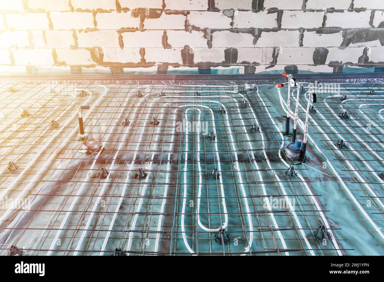 Underfloor heating pipes installation on construction site Stock Photo ...