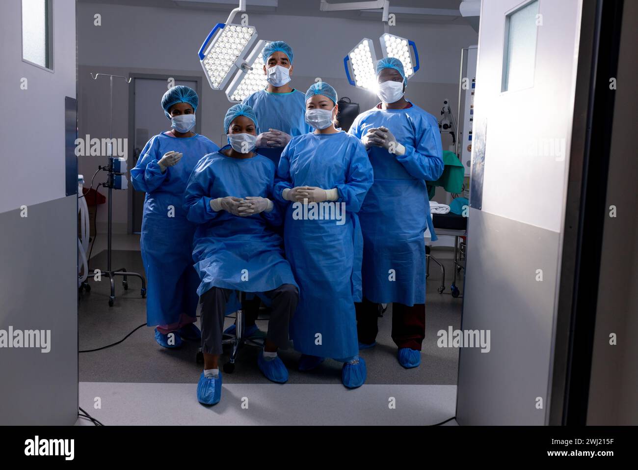 Portrait of diverse male and female doctors wearing face masks in ...