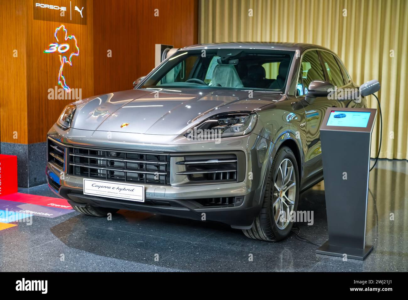 Porsche cayenne gray in the showroom on the shop showcase exhibition of an official dealer ...