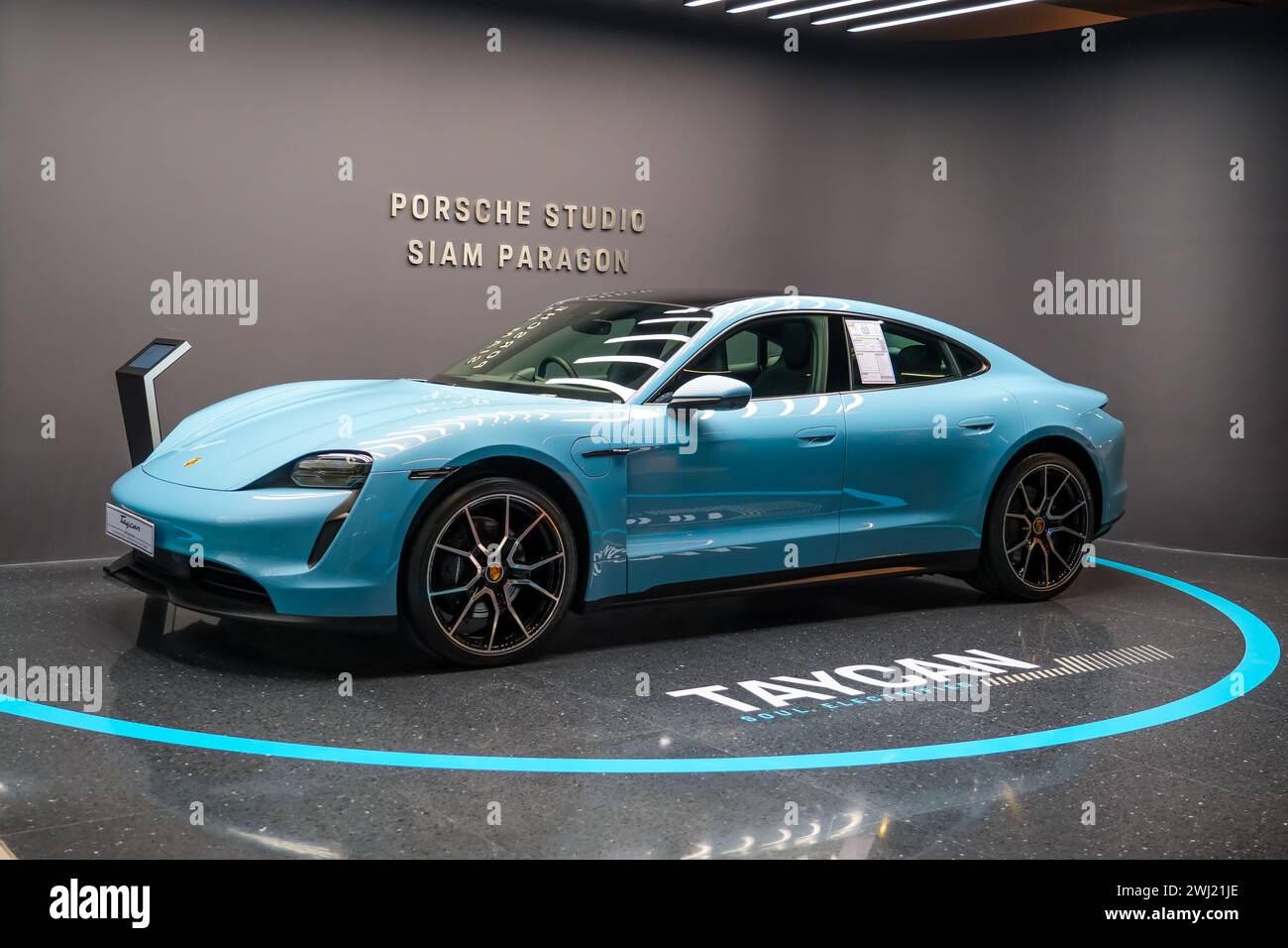 Electric light blue Porsche Taycan Turbo S and Taycan 4. Thailand, Bangkok 21 december 2023 ...
