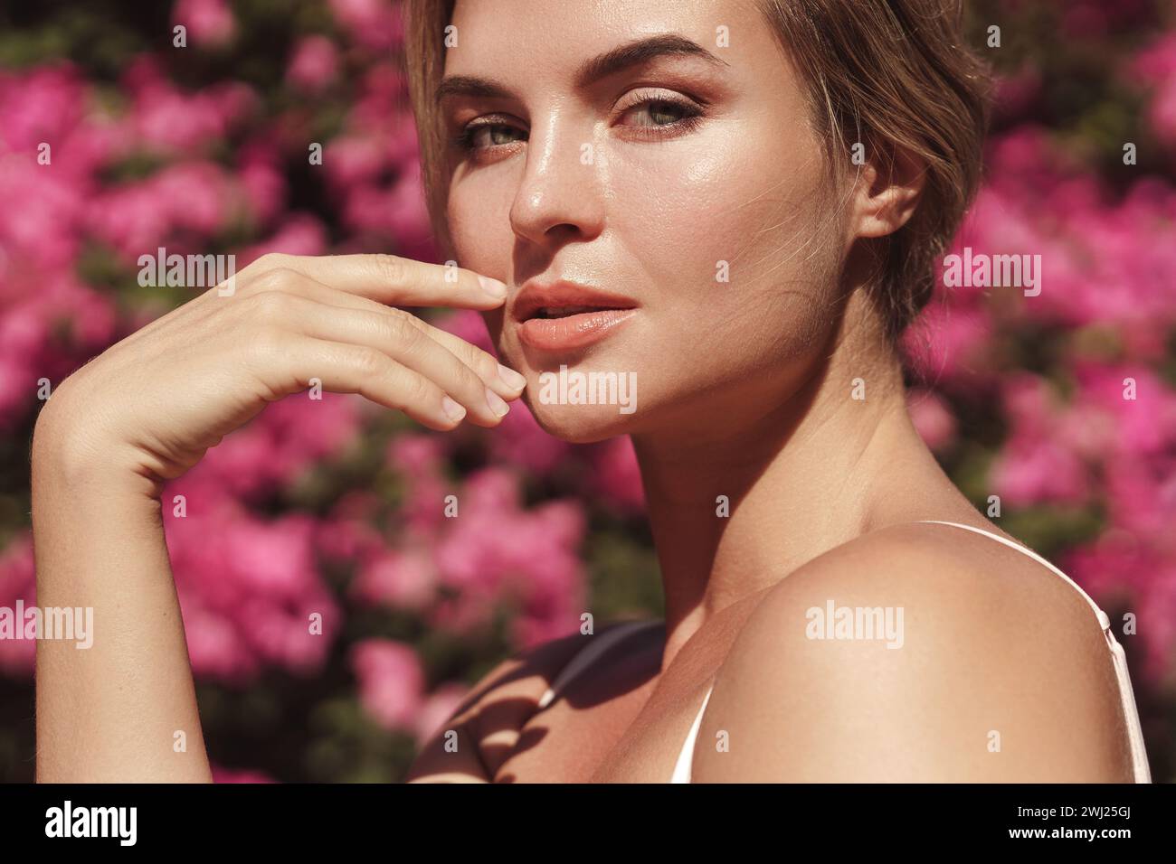 Beautiful blonde woman with smooth skin and natural makeup, as she ...