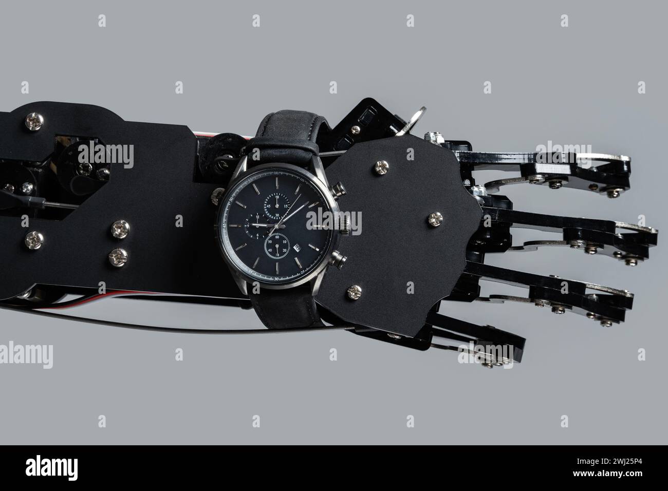Real robotic hand with wristwatch. Concepts of time management or speed ...