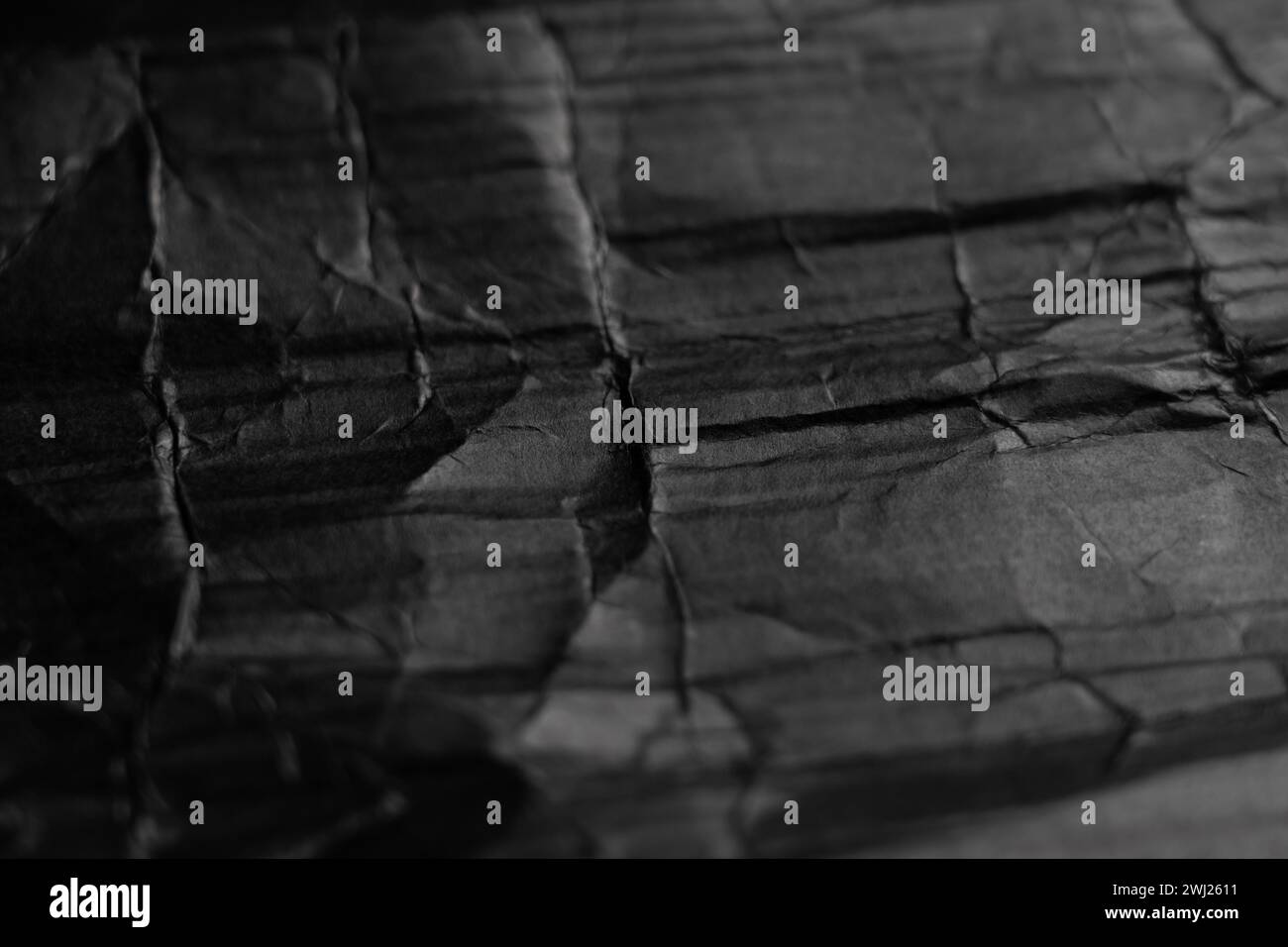 Crumpled black paper with wrinkles and folds. Dark cardboard abstract ...