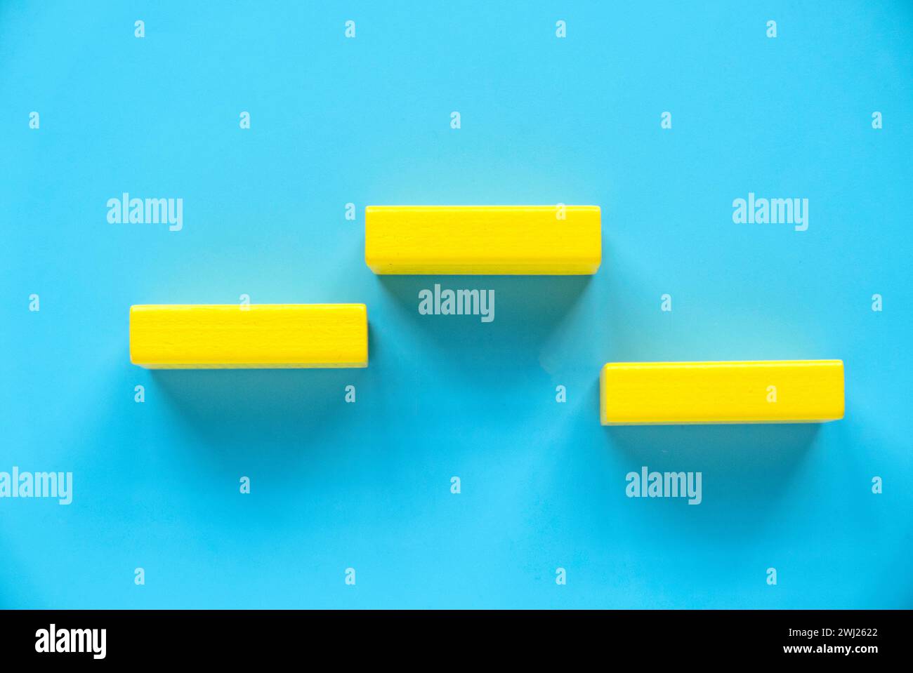 Winner podium, stage or pedestal. Yellow wooden block over a blue ...