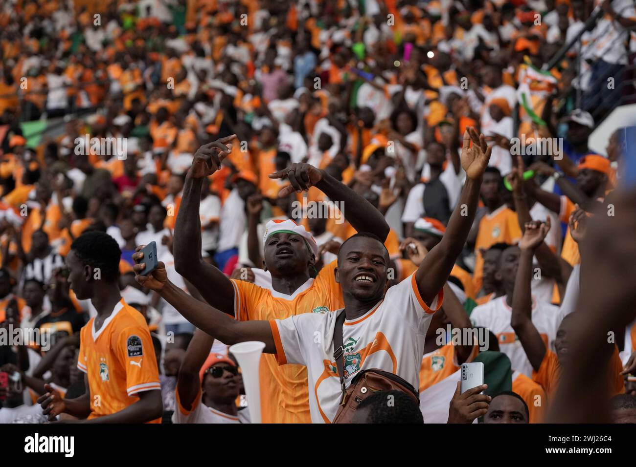 Ivory Coast supporters wait for their team to arrive at the Felix ...