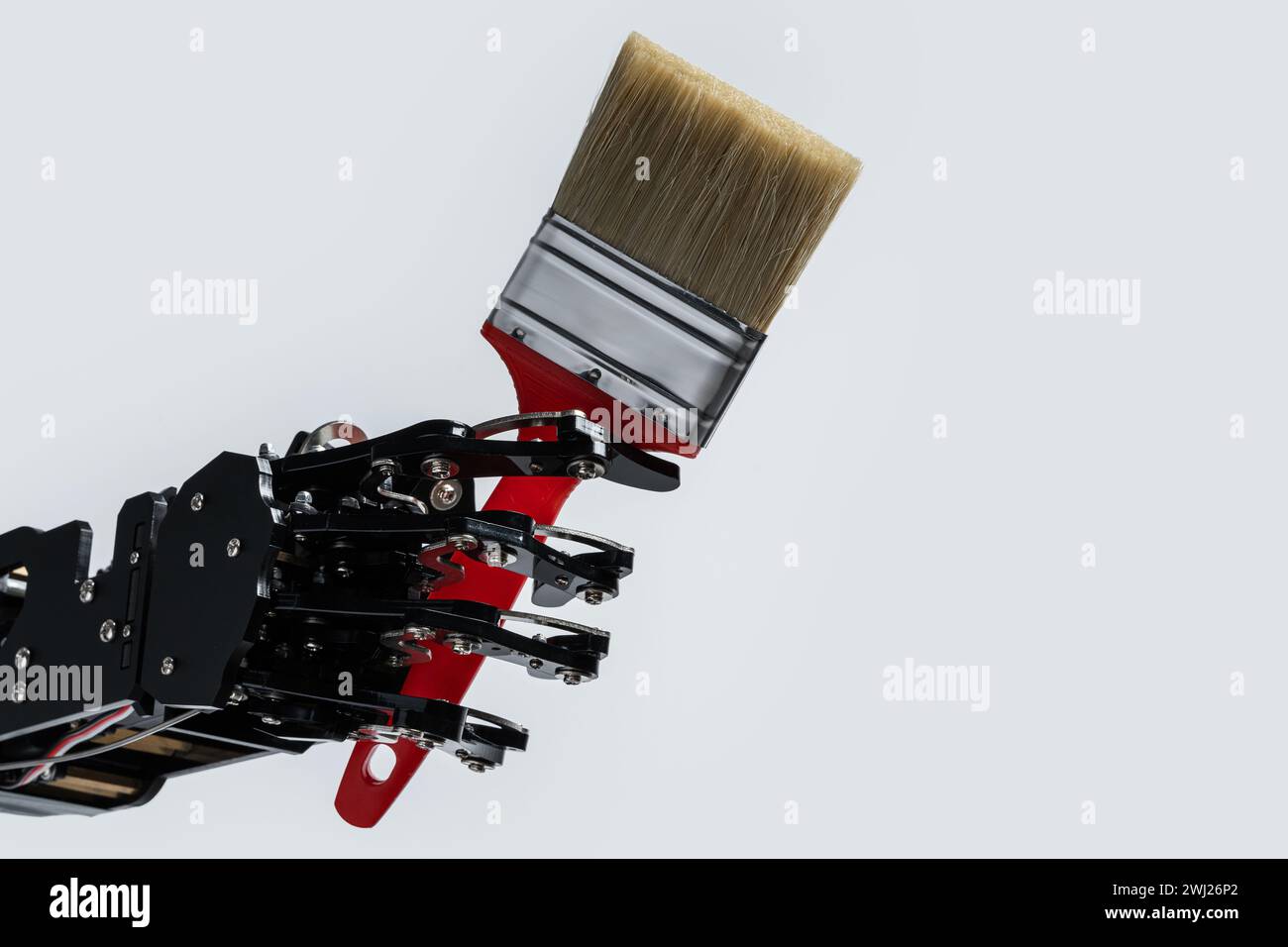 Real robotic hand with paintbrush. Concepts of Artificial intelligence ...