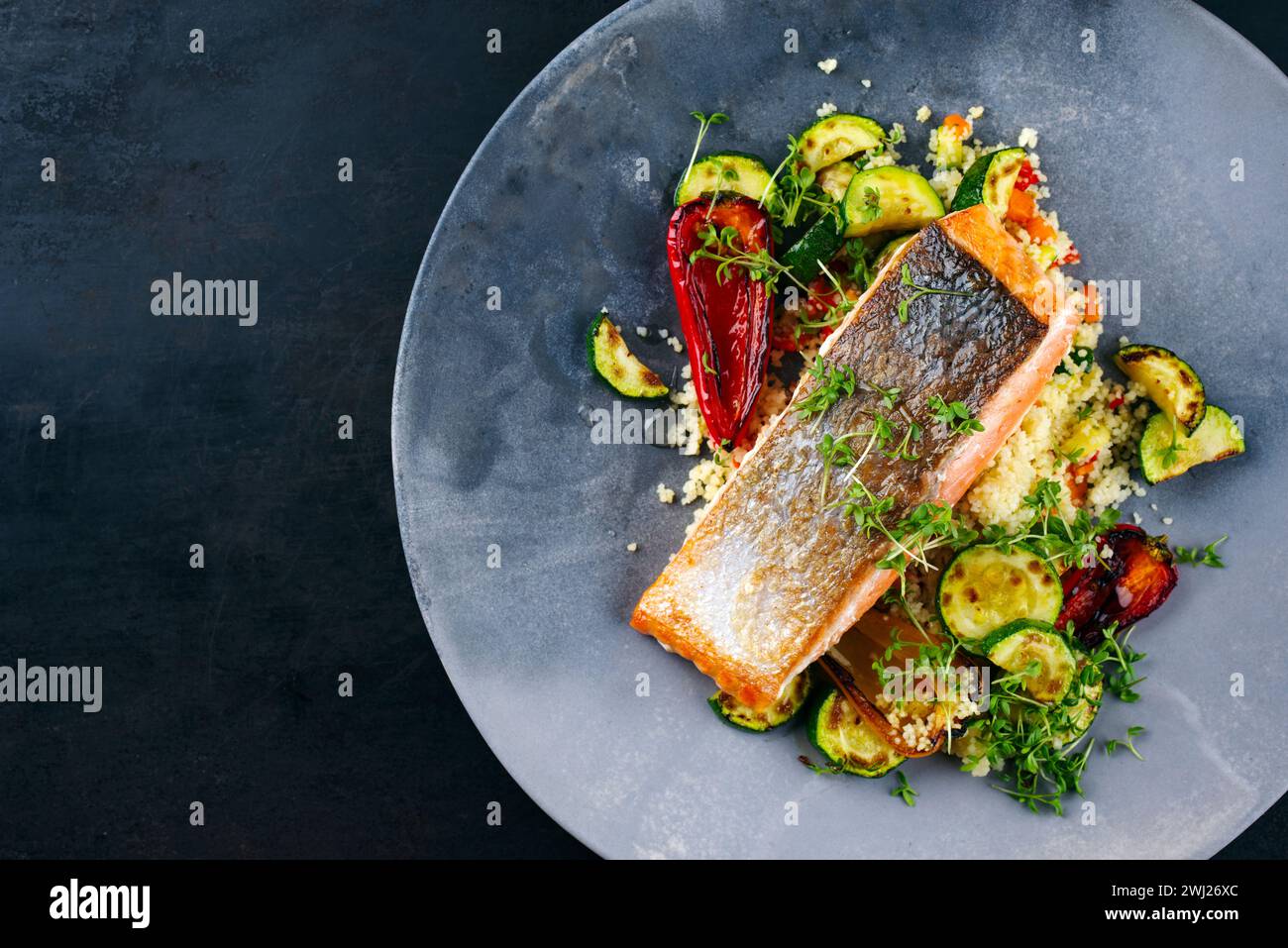 Traditional Mediterranean salmon fish fillet with vegetable cuscus ...