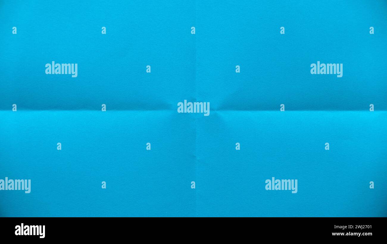 Folded blue color paper for background Stock Photo - Alamy