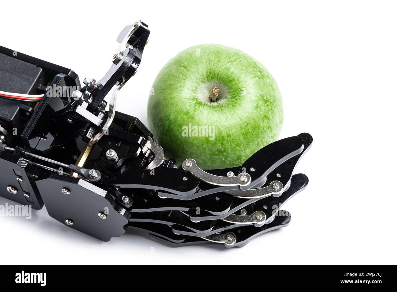 Real robot's hand with green apple. Concept of Artificial intelligence ...