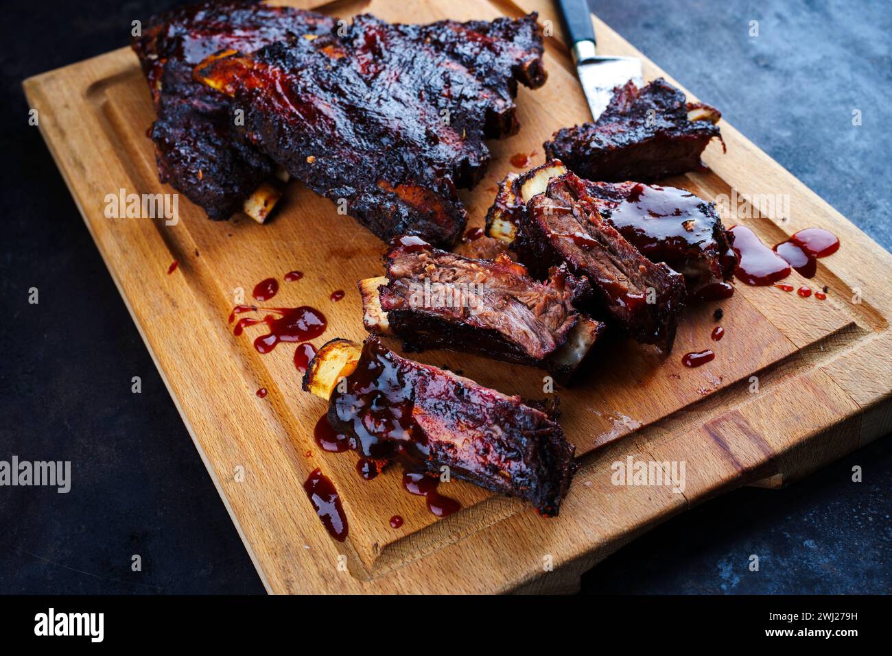 Traditional barbecue burnt chuck beef ribs marinated with spicy rub and ...