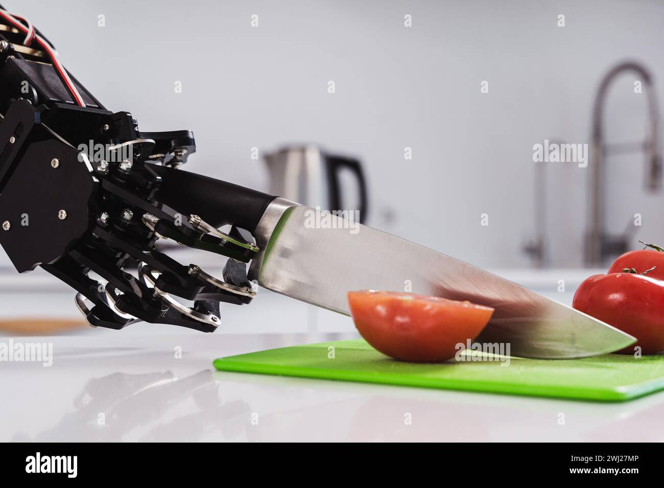 Real robot's hand cutting fresh tomatoes with sharp knife. Concept of ...