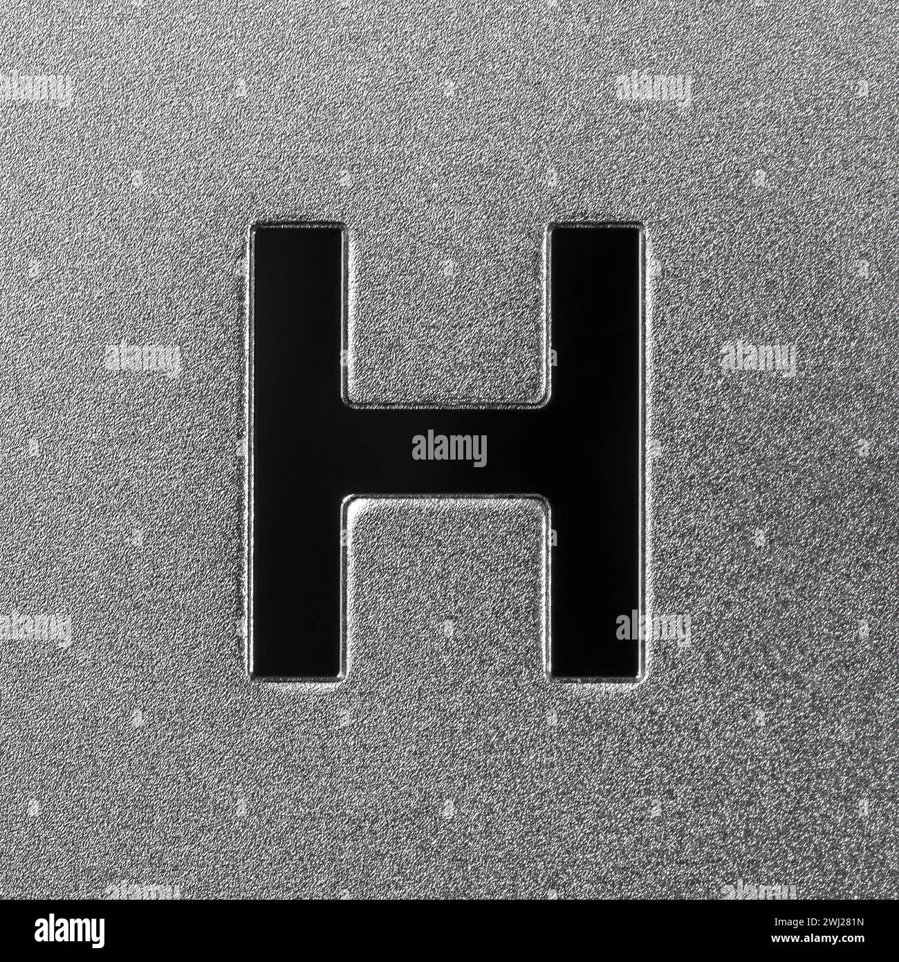 Letter H on a silver grained shiny metal surface. English alphabet ...