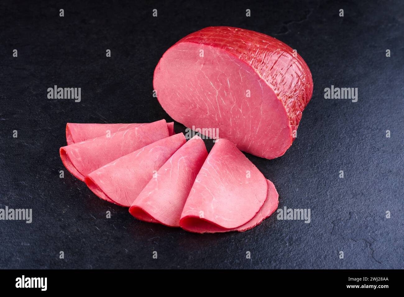 Traditional smoked Allgäu beef ham sliced and offered in one piece as a ...