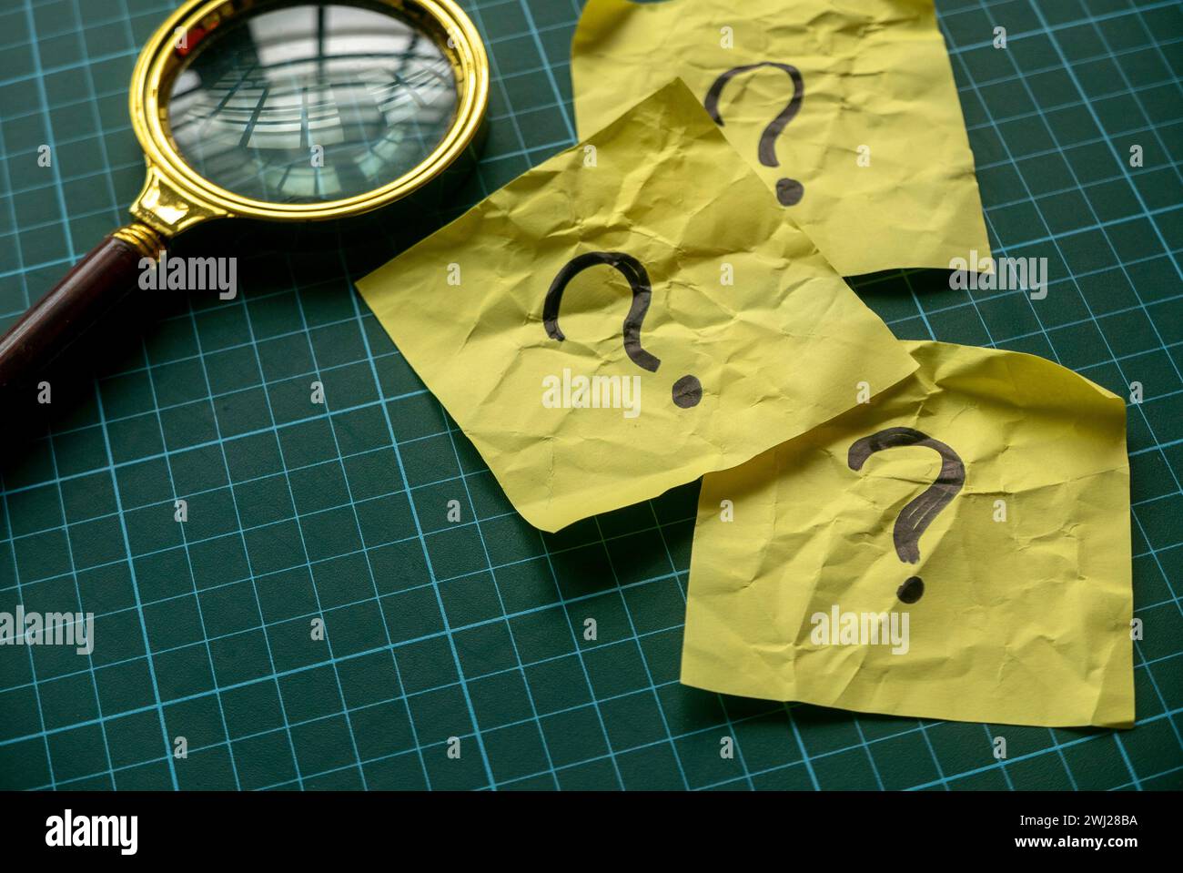 Q&A or questions and answers concept. Crumpled paper note written with ...