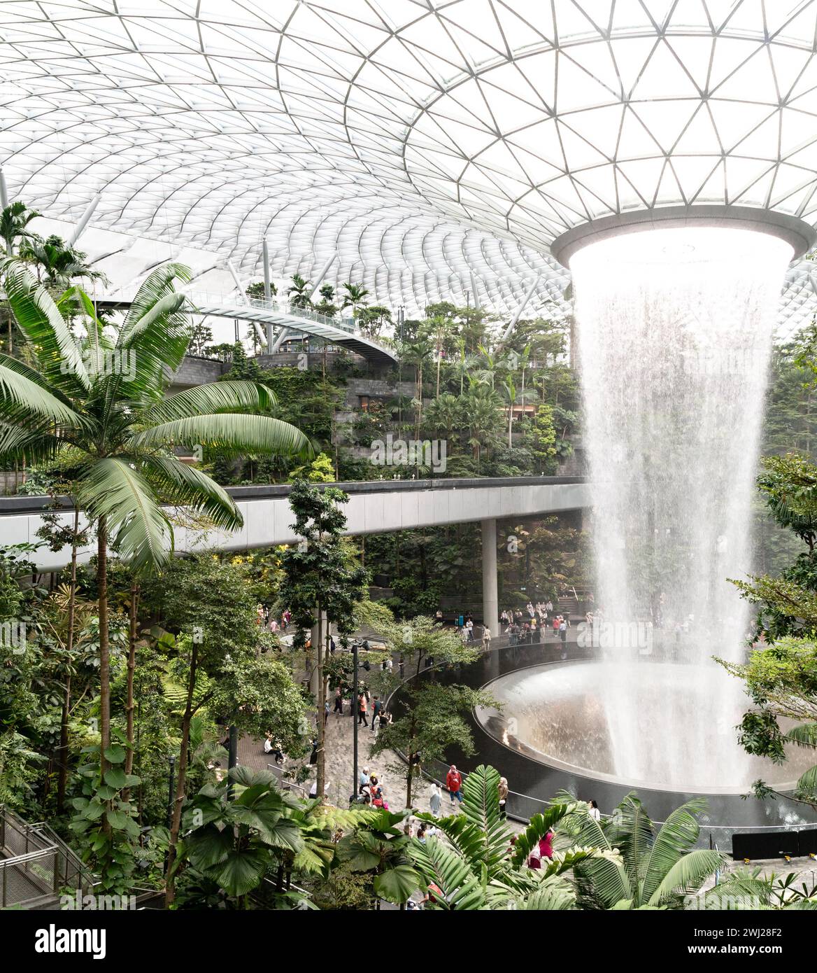 Tourists visiting iconic waterfall at The Jewel in Changi Airport Stock ...