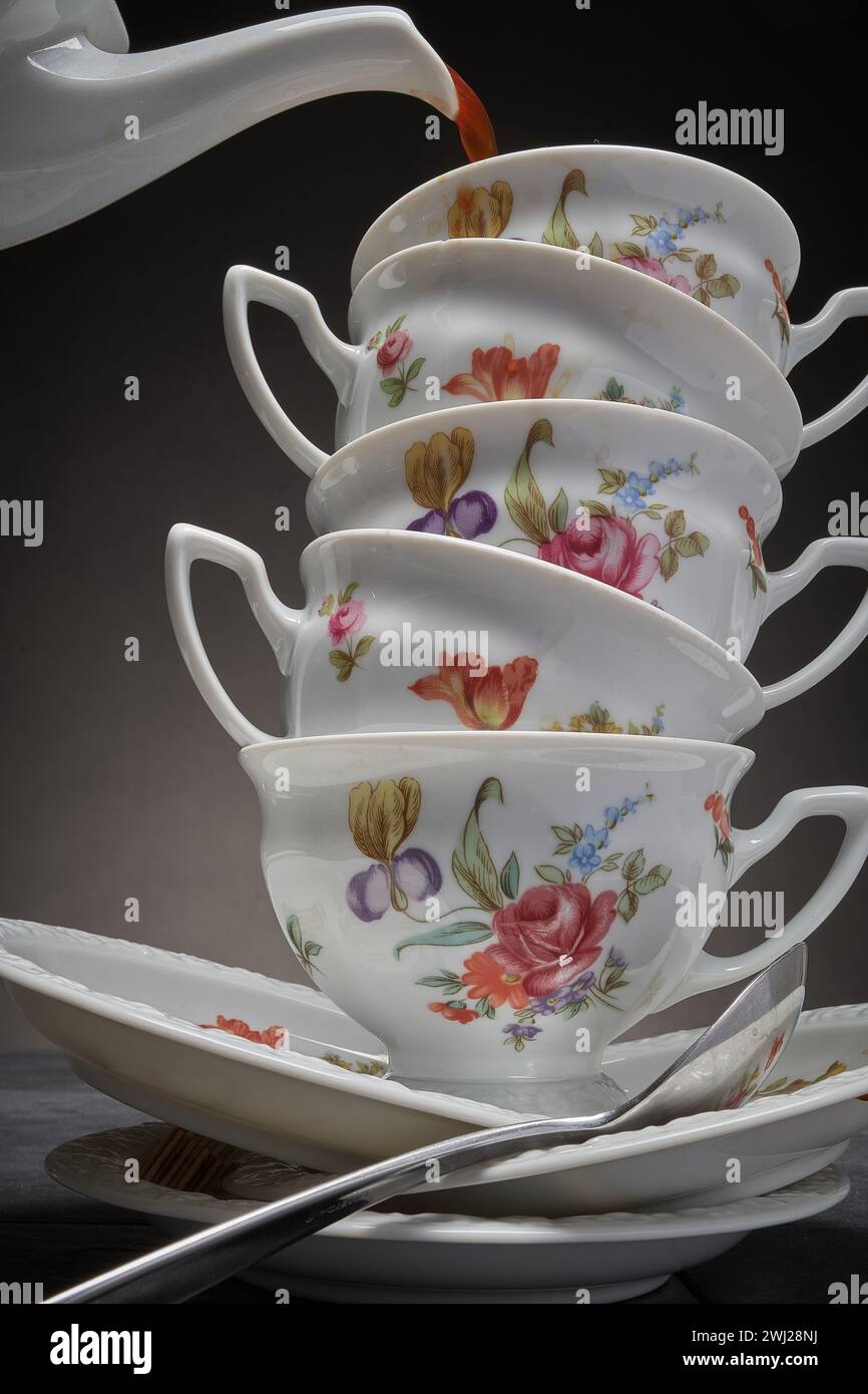 Stacked coffee cups and coffee pot Stock Photo - Alamy