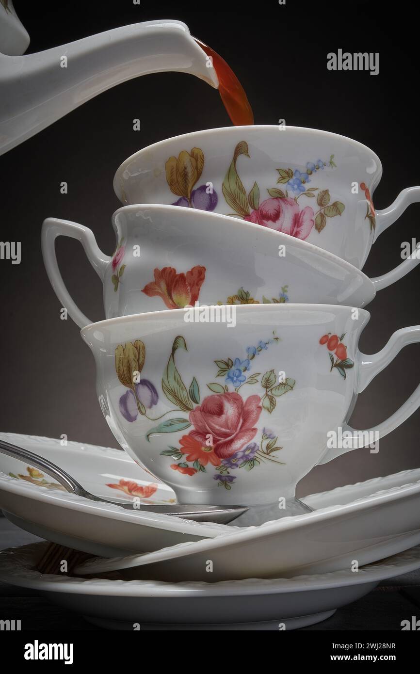 Stacked coffee cups and coffee pot Stock Photo - Alamy