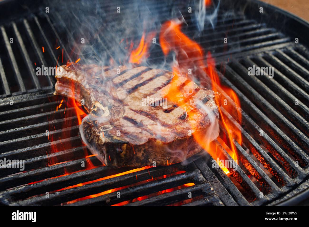 Barbecue dry aged wagyu prime rib beef steak grilled as close-up on a ...