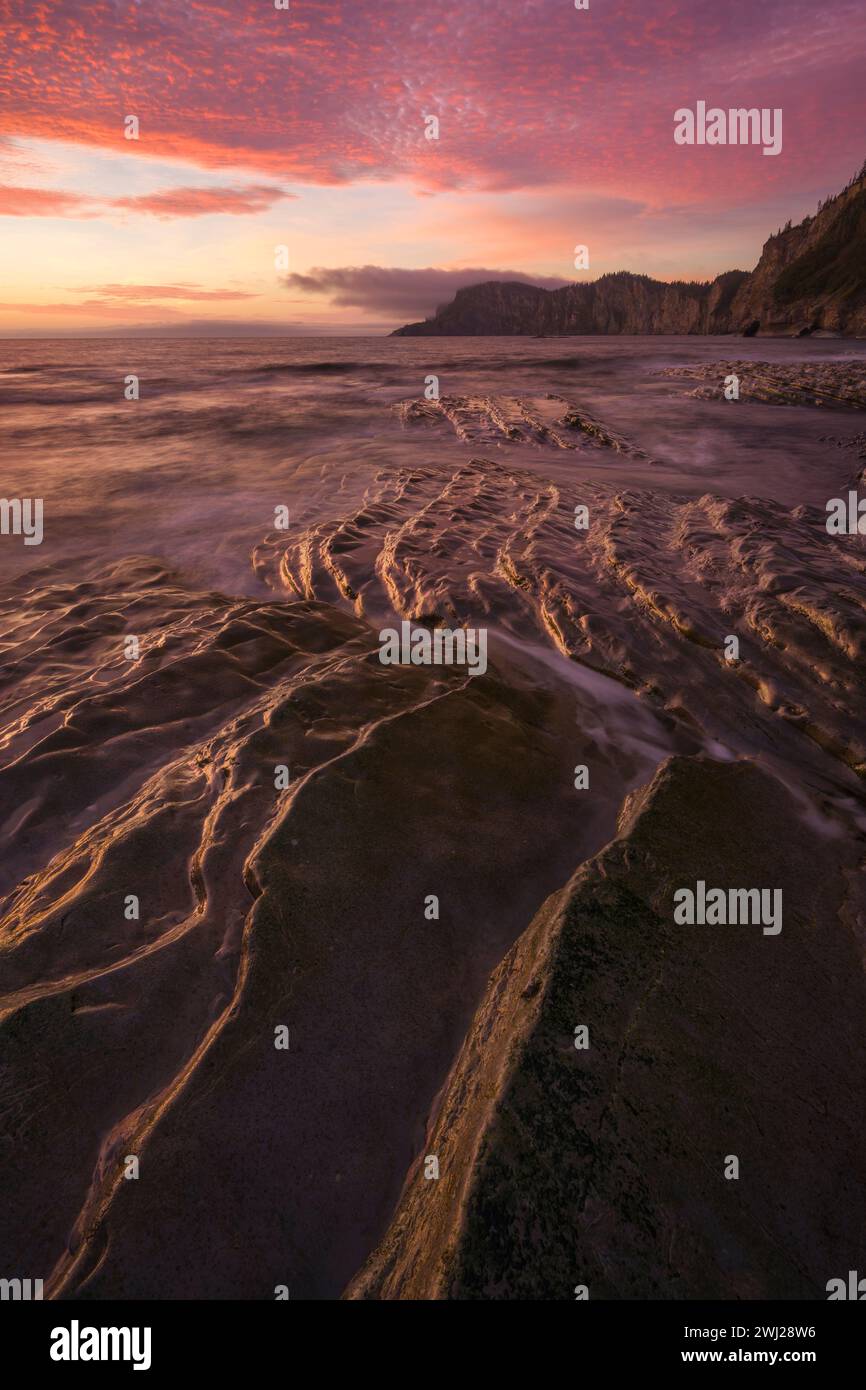 Smooth Rocks and Ocean Cliffs at Sunrise Stock Photo - Alamy