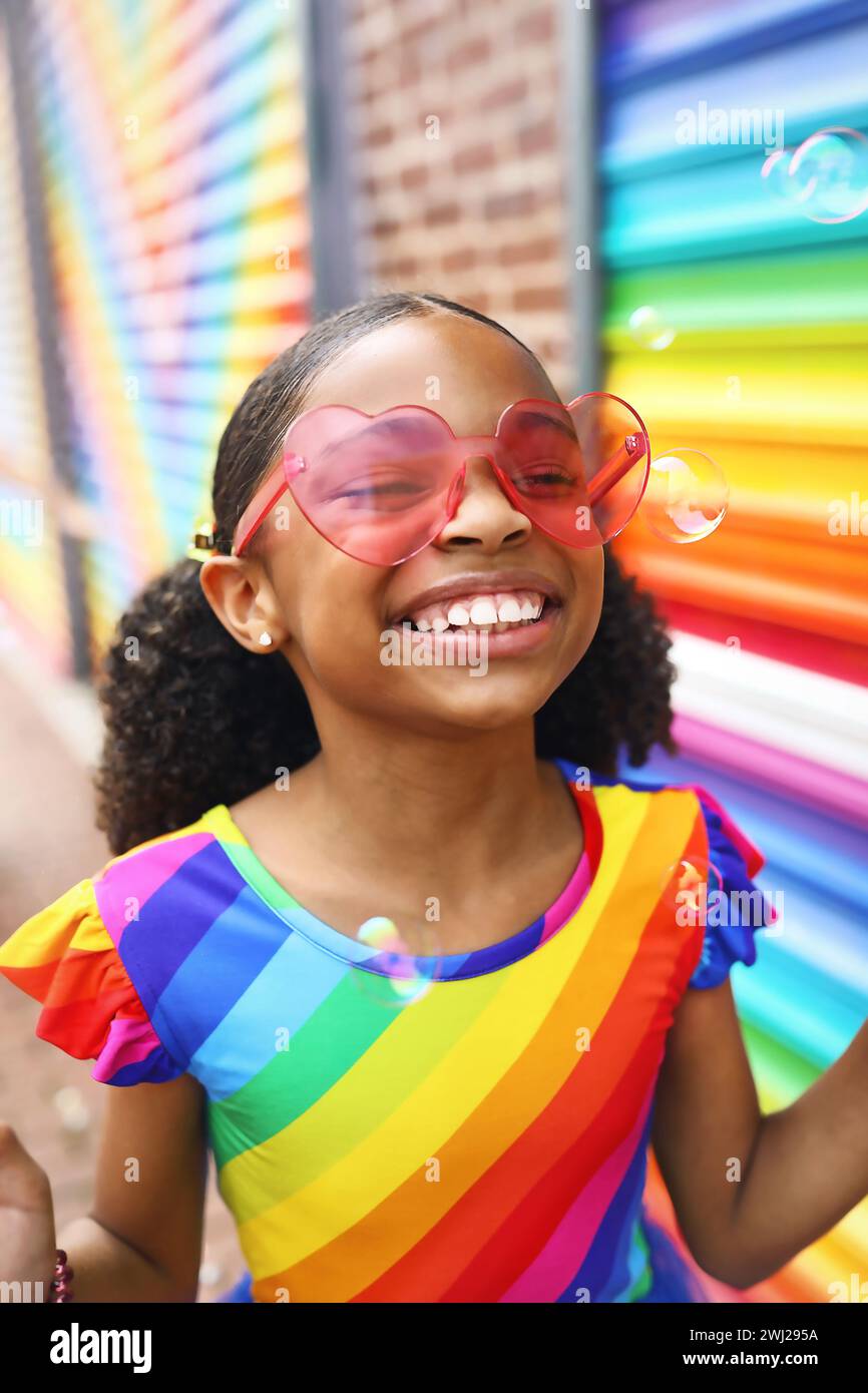 Young Girl with Big Smile in front of a mural in Washington, DC Stock ...