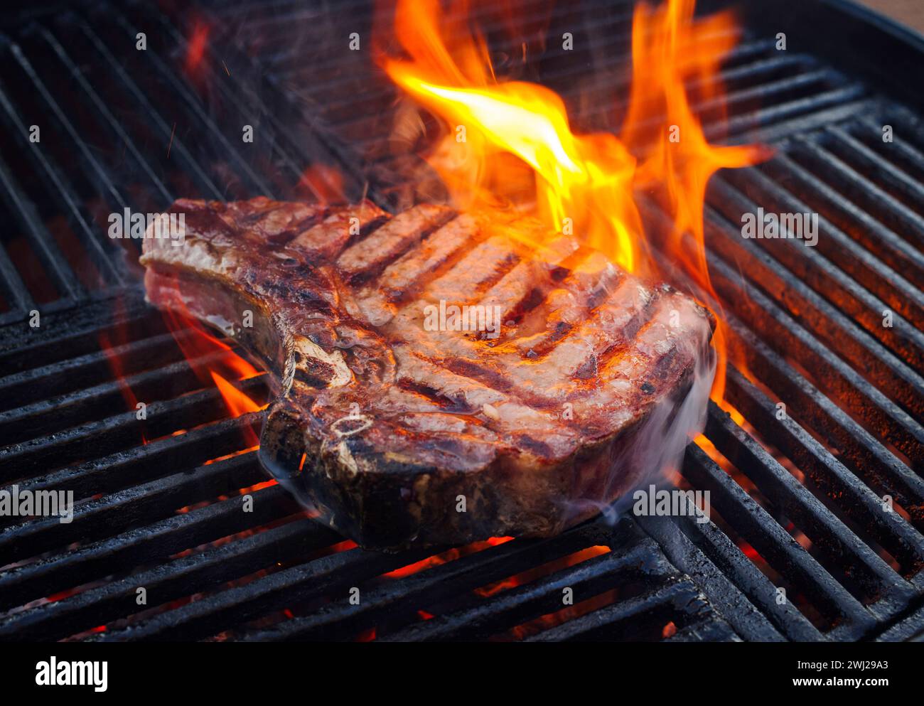 Barbecue dry aged wagyu prime rib beef steak grilled as close-up on a ...