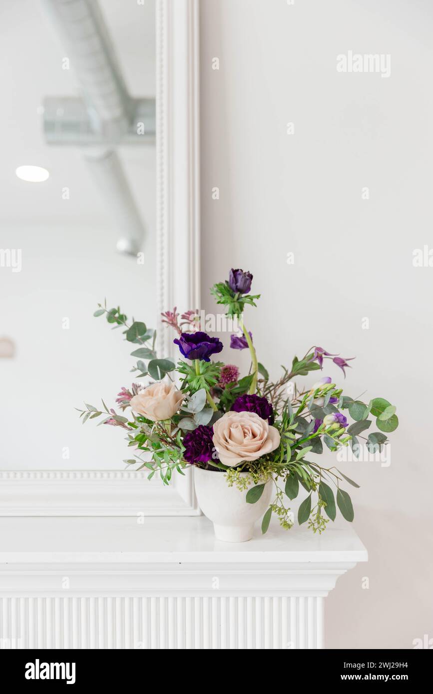 Muted Purple Floral Arrangement in Minimal Home Setting Stock Photo - Alamy