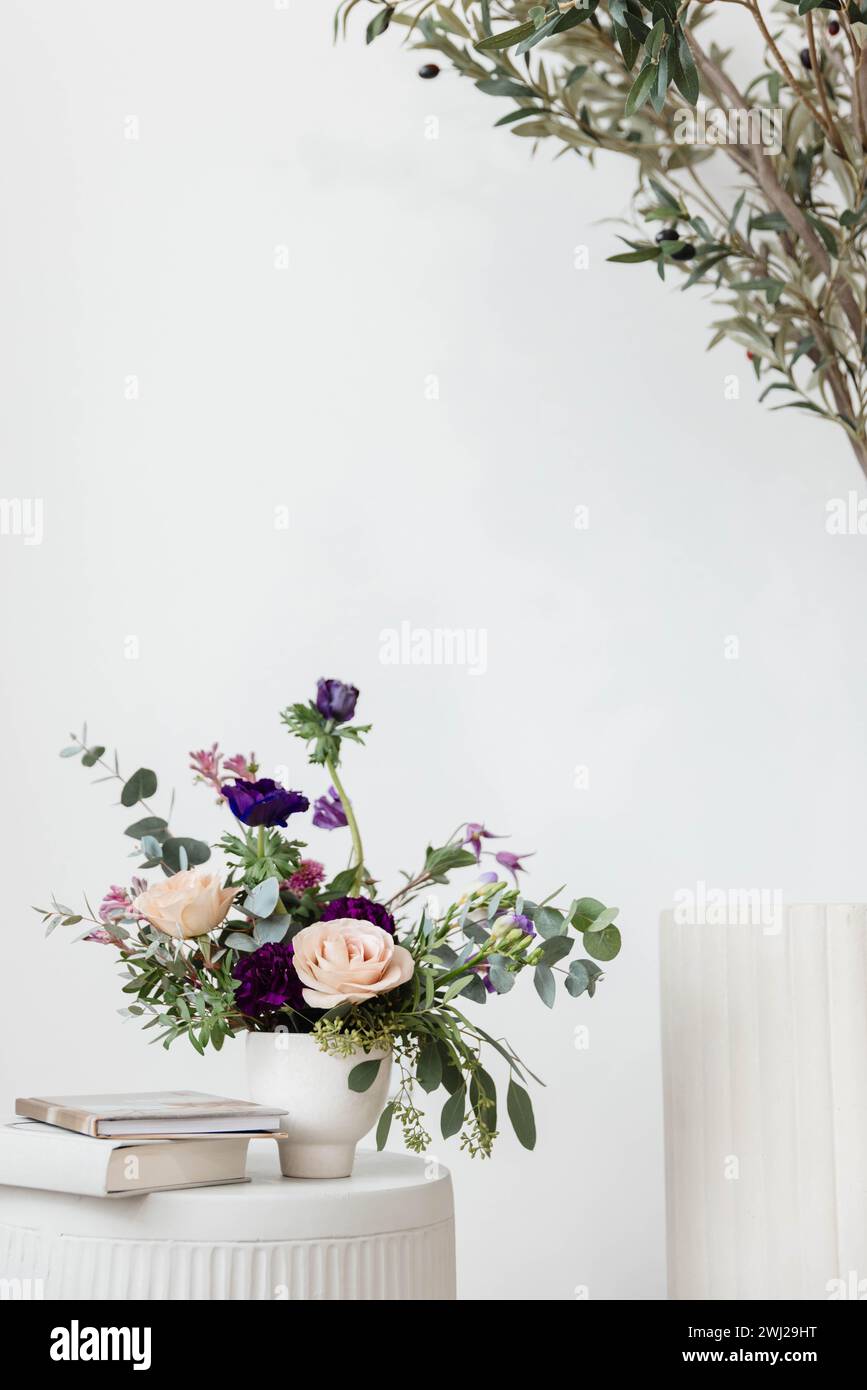 Muted Purple Floral Arrangement in Minimal Home Setting Stock Photo - Alamy