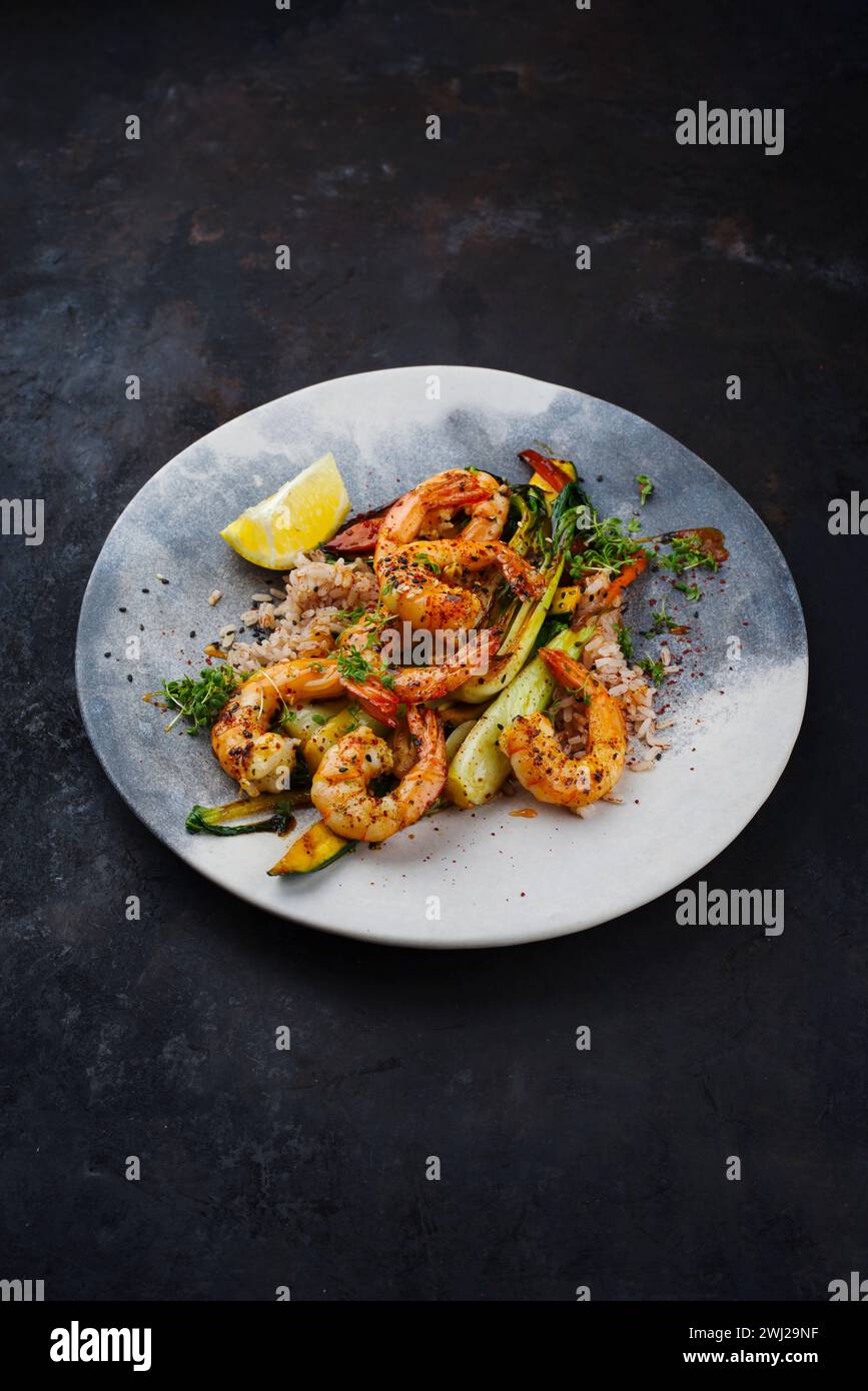 Traditional Thai fried king prawns with Asian vegetable and rice served ...
