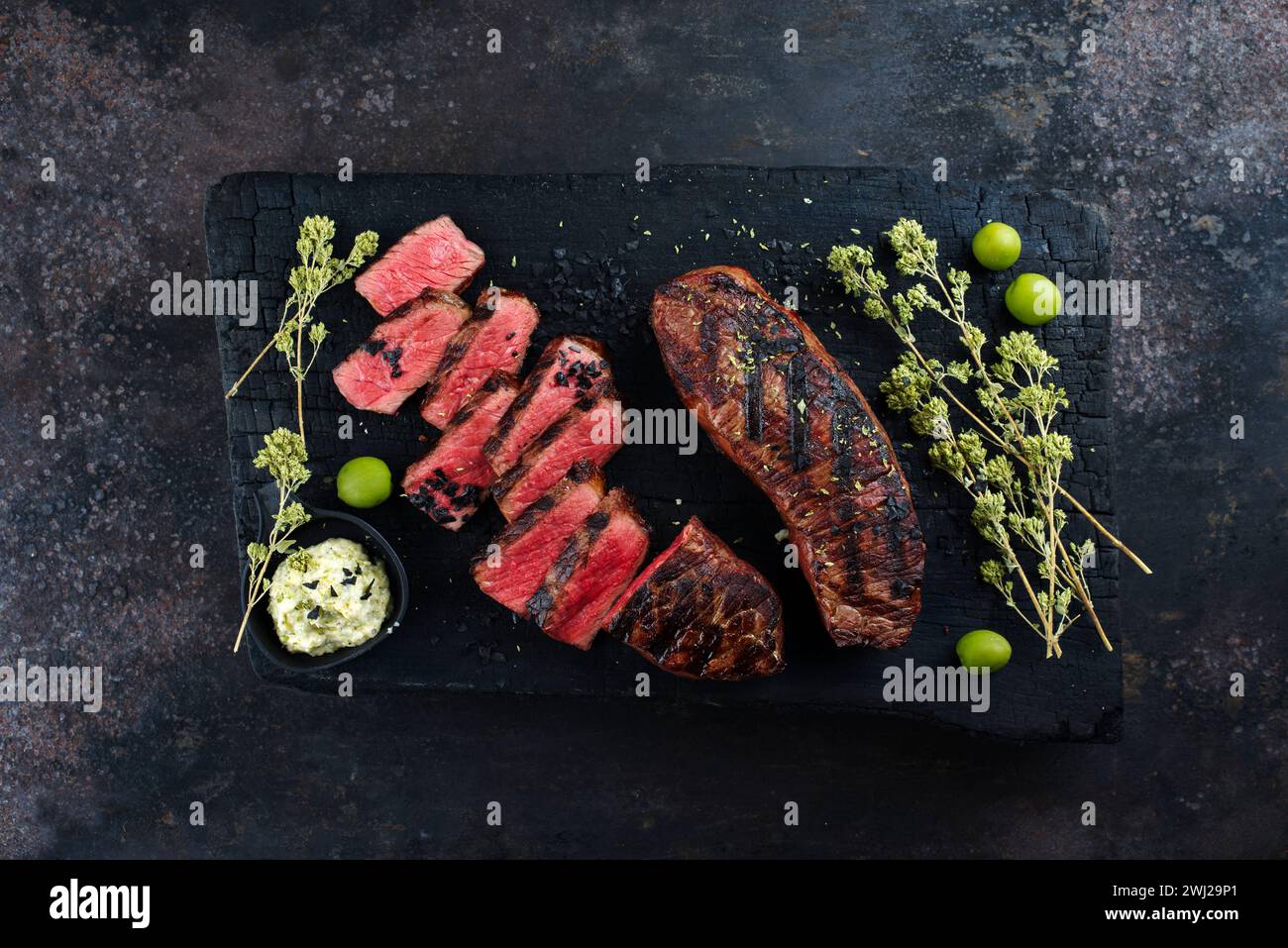 Barbecue dry aged angus roast beef steak with herb butter and dried ...