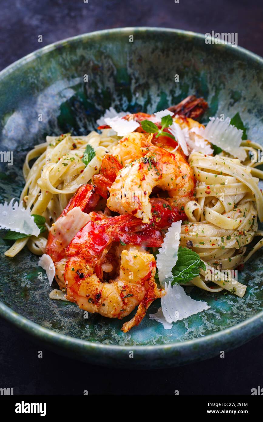 Traditional fried king prawns with Italian tagliatelli pasta and ...