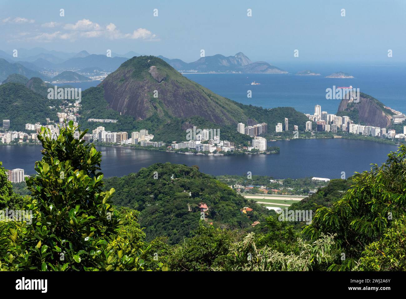 Beautiful view to green rocky rainforest mountains and city Stock Photo ...