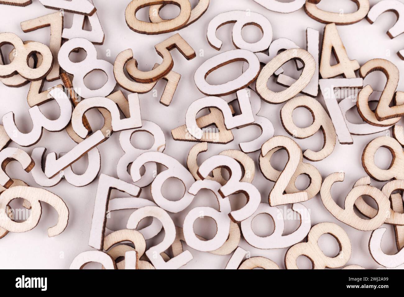 a collection of individual numbers lying isolated on a white background ...