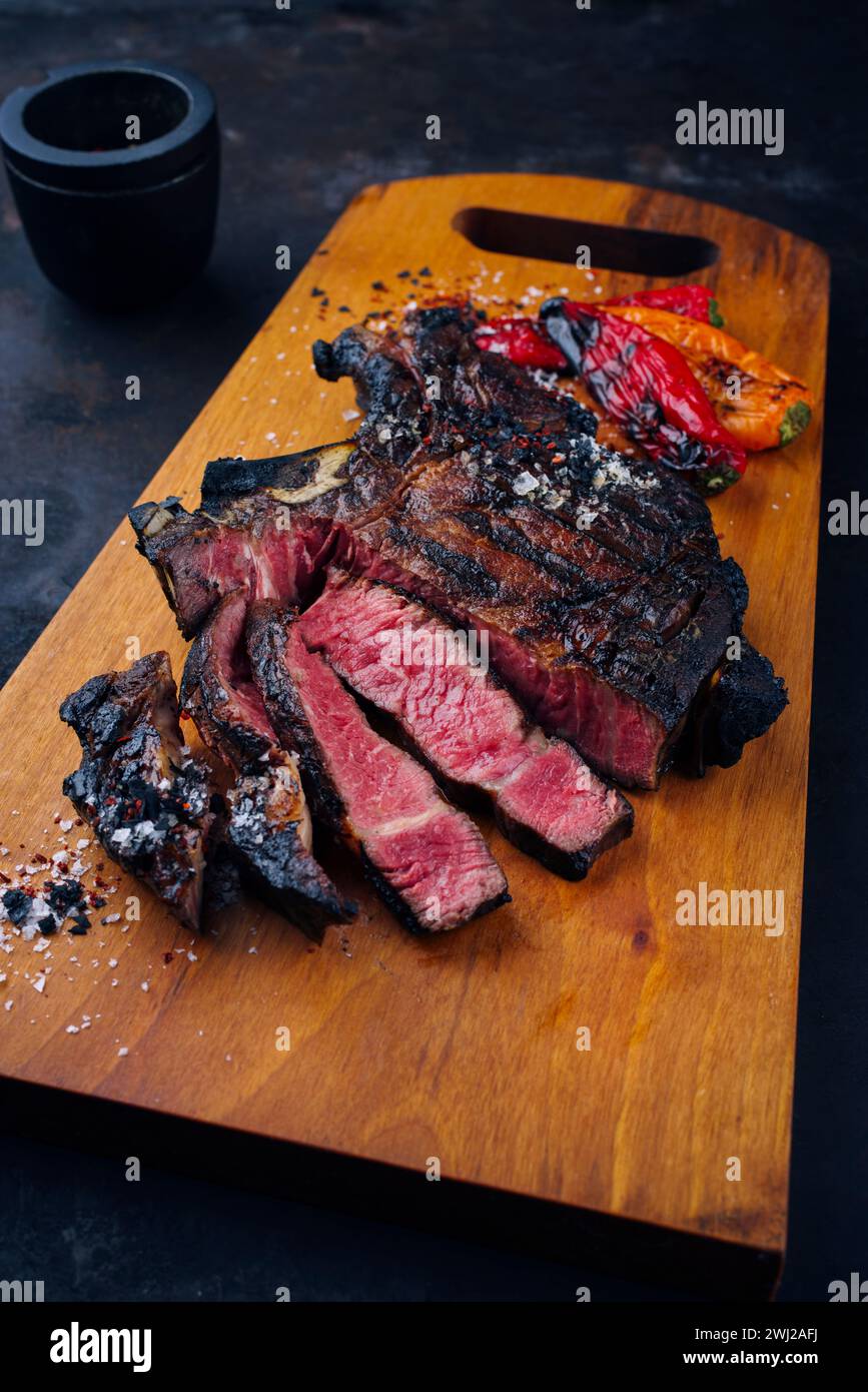 Traditional barbecue dry aged angus rib of beef steak with grilled ...