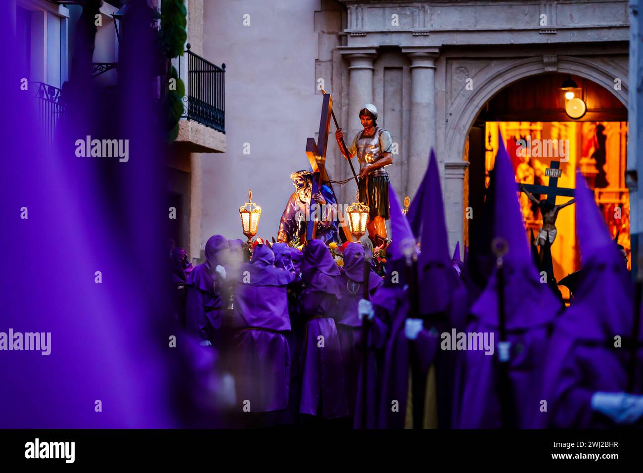 Nazarenes with Christ in the background in Villajoyosa Stock Photo - Alamy