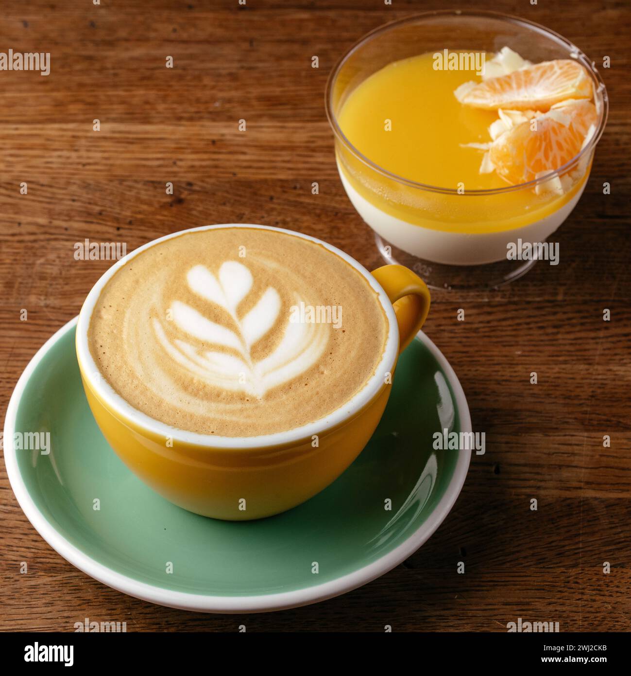 cappuccino in a mug and dessert on a plate. coffee shop menu Stock ...