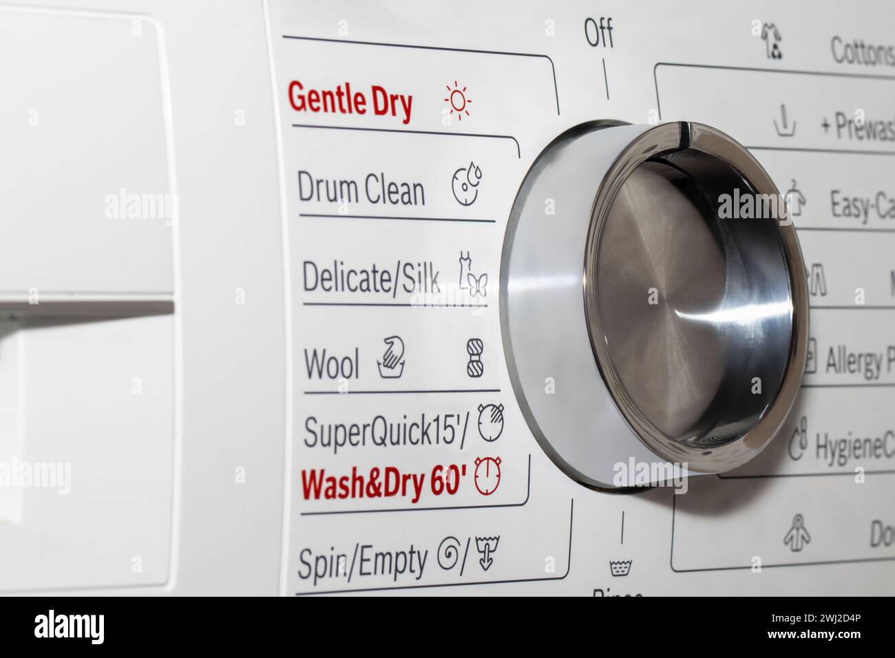 This image captures the detailed control panel of a modern washing ...