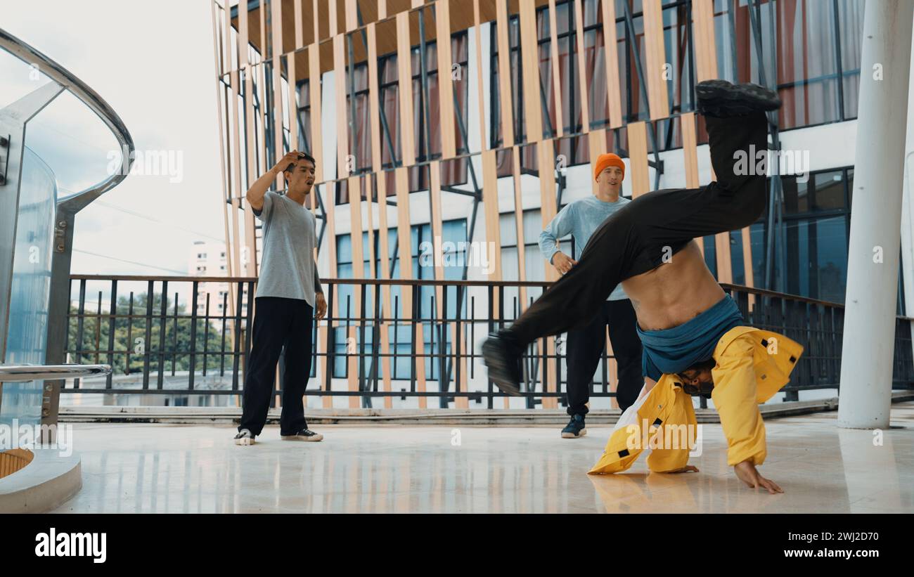 Hip hop team dance break dance while multicultural friend surrounded ...