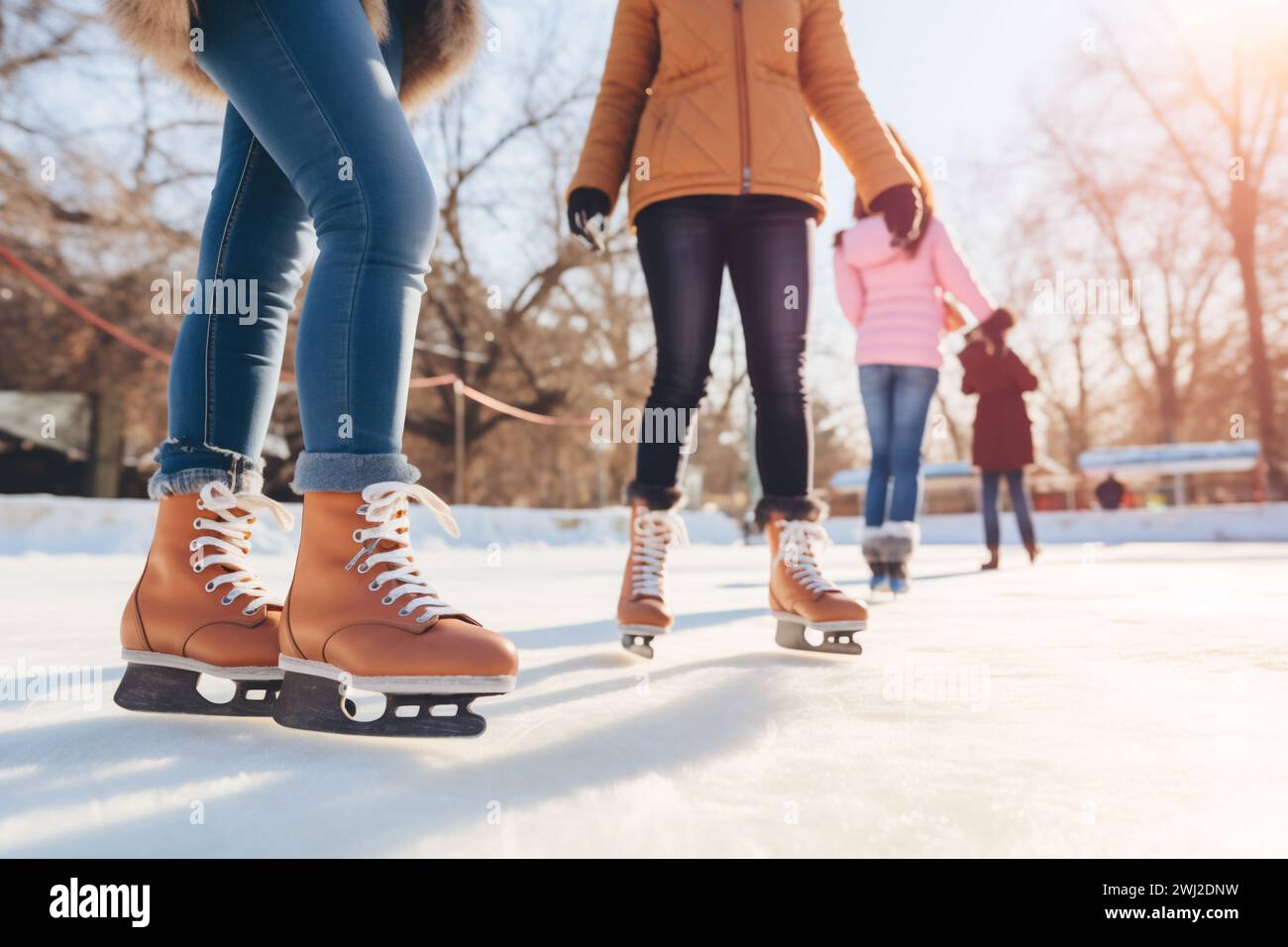 Children friends group skating on outdoor skating rink. Legs in skates ...