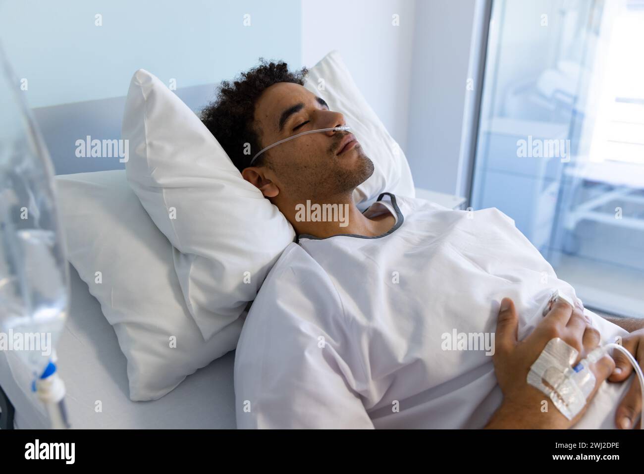 Man hospital bed drip hi-res stock photography and images - Alamy