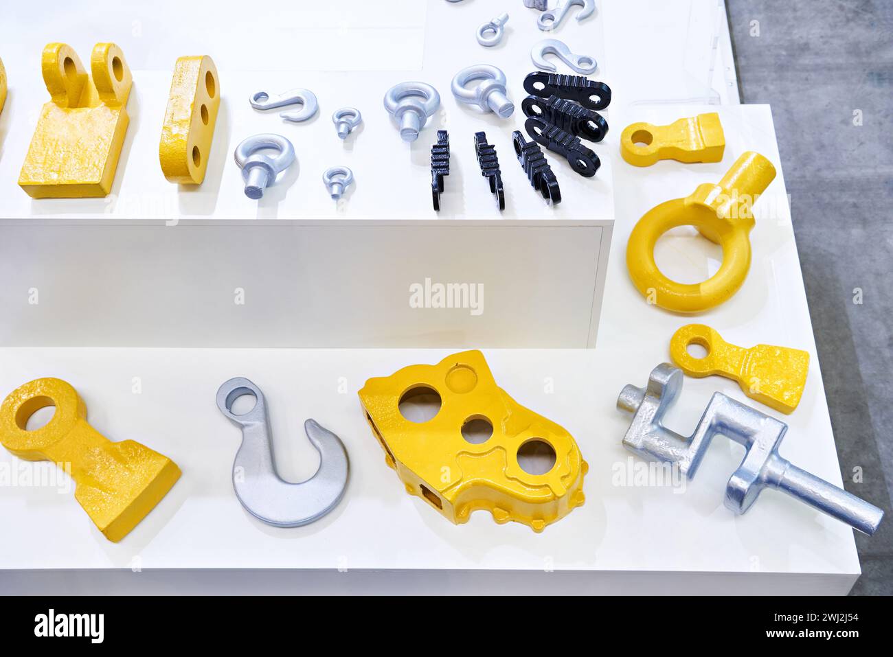 Steel spare parts for mining equipment on exhibition Stock Photo - Alamy