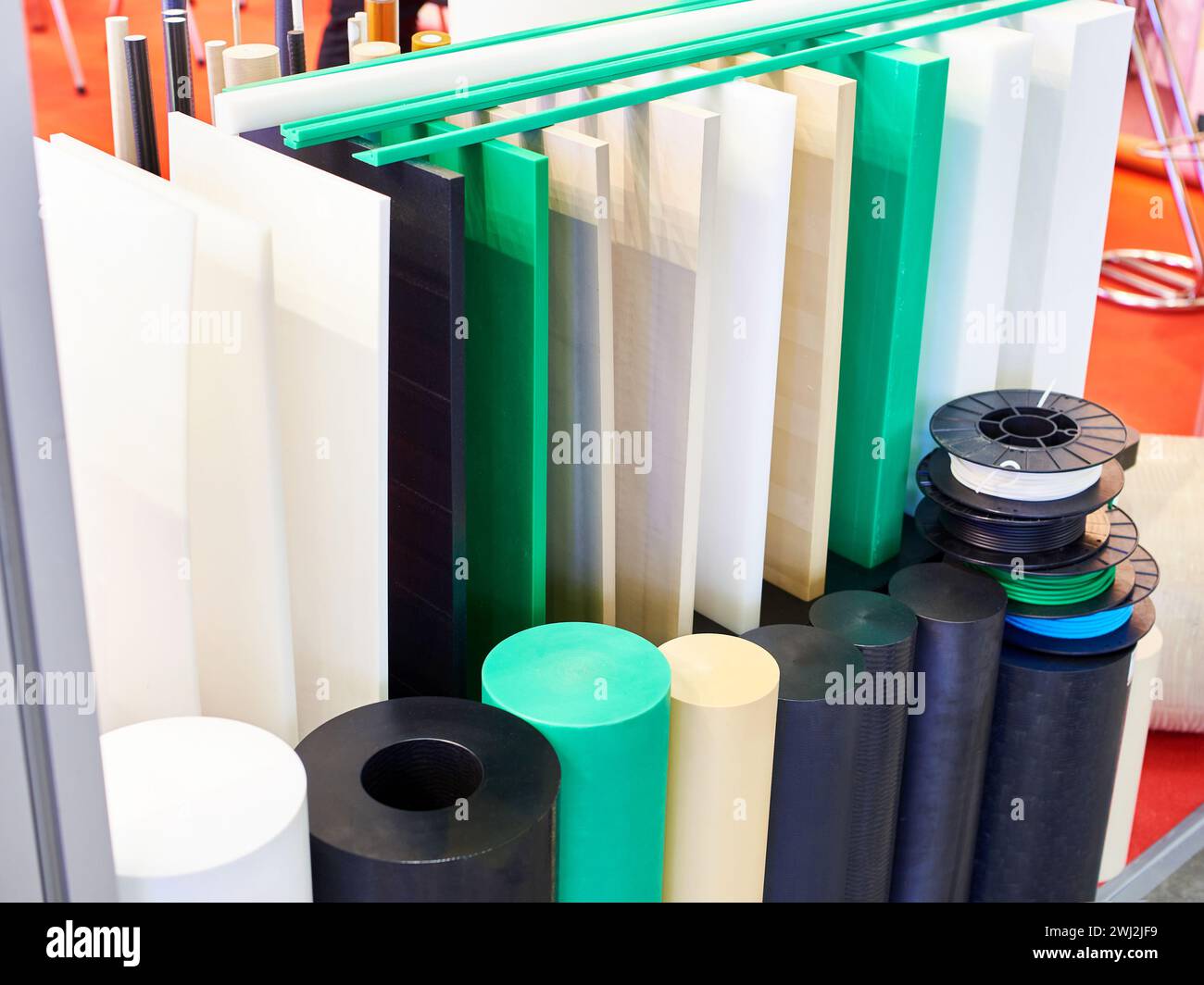 Pipes, rods and sheets of composite and plastic materials in store of ...