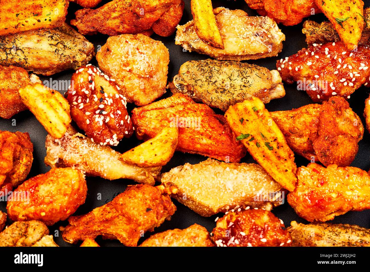 Deep fried Crispy chicken wings with different flavors and sauces on ...