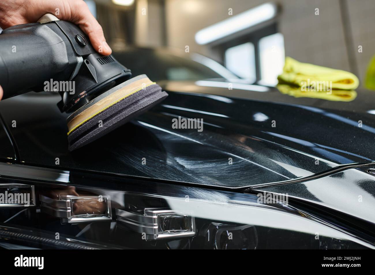 cropped view of devoted professional worker working with polishing ...
