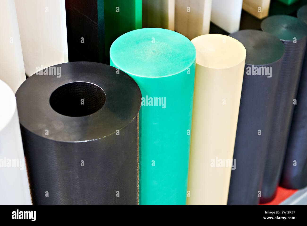 Pipes, rods and sheets of composite and plastic materials in store of ...